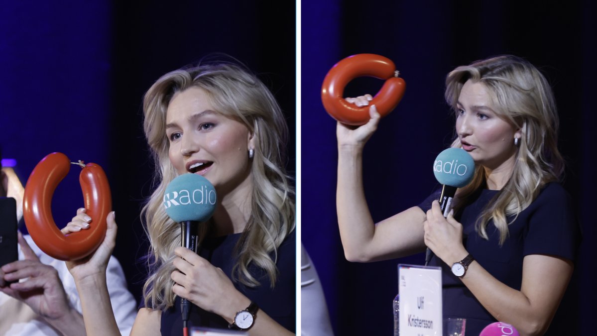 Här viftar Ebba Bush med korv under debatten